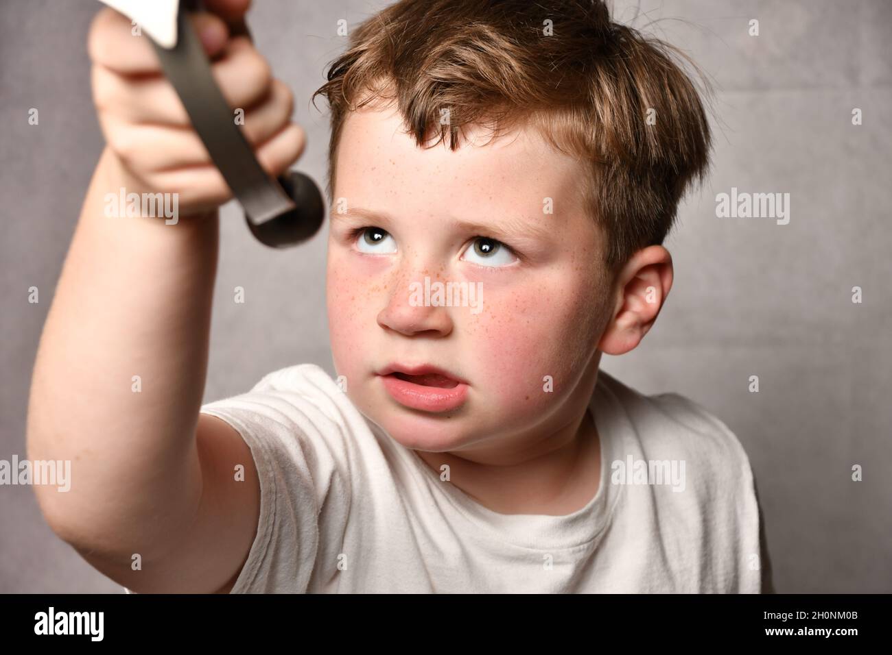 Dramatic white boy Stock Photo - Alamy