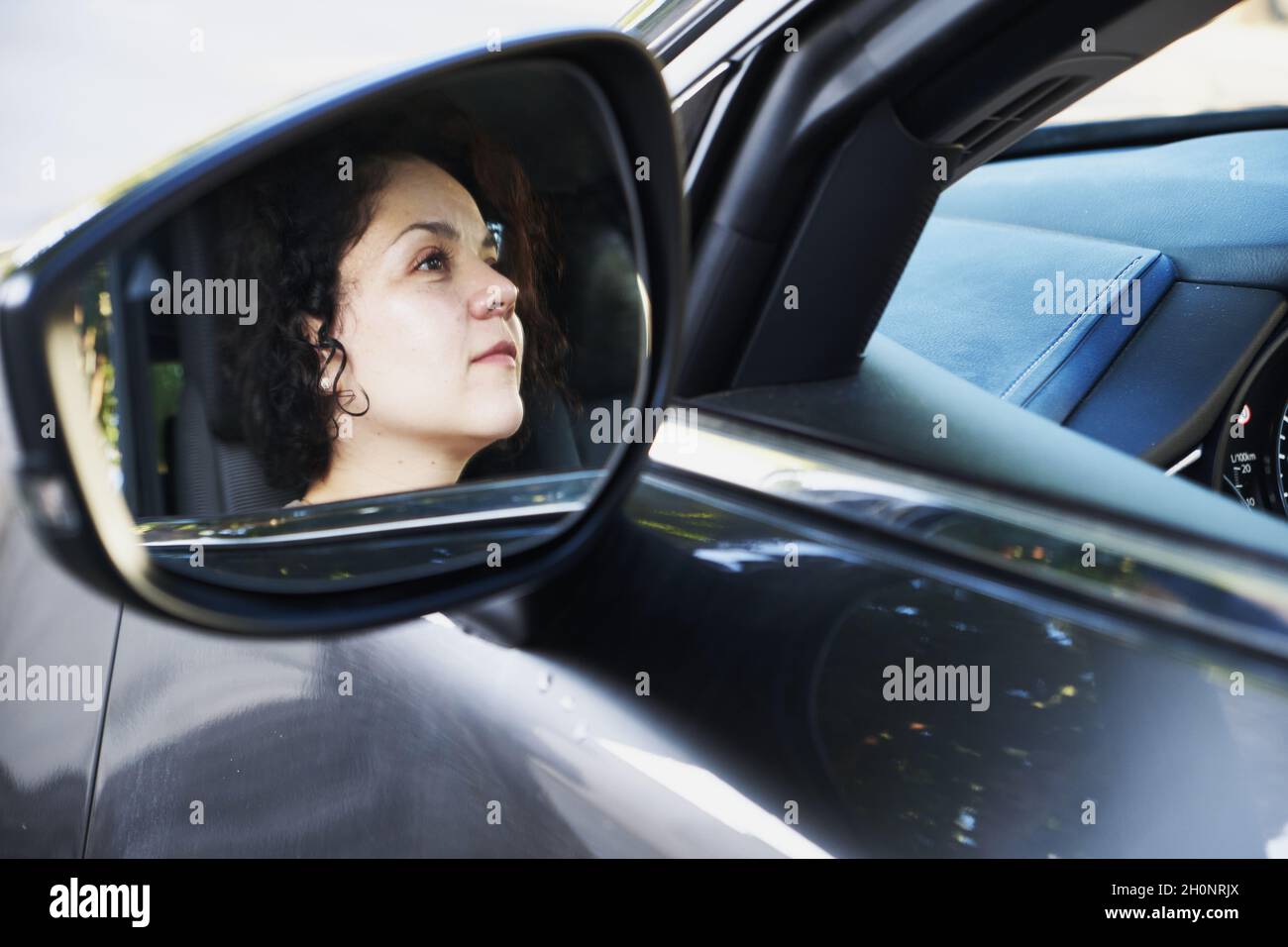 Beautiful female driving her car Stock Photo - Alamy