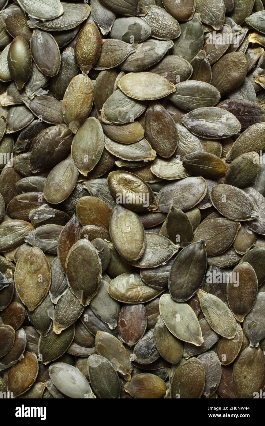 A closeup view from above on a pile of raw shelled pumpkin seeds Stock ...