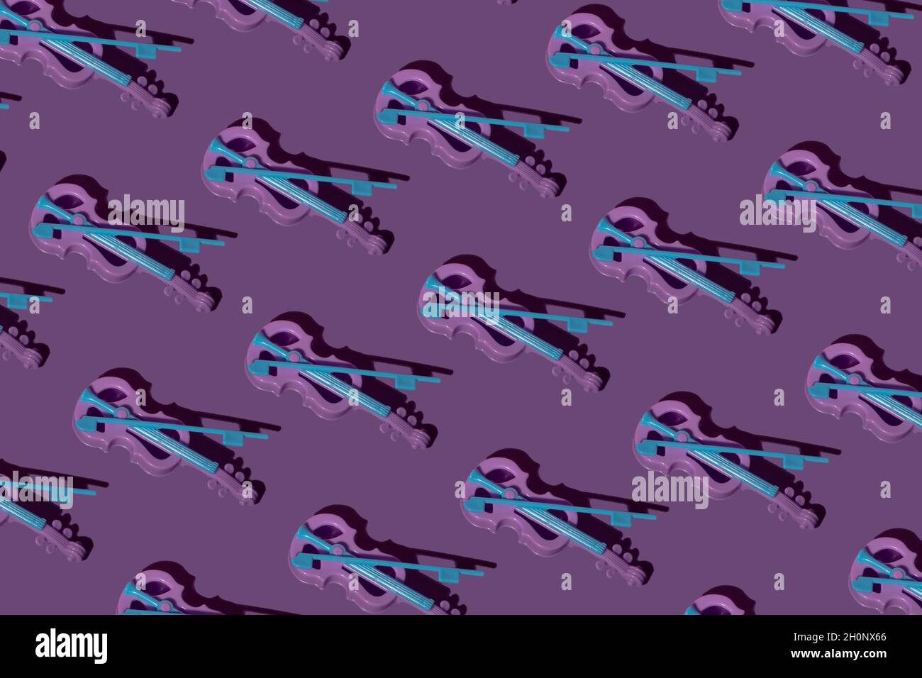Kid toy violin pattern on trendy ultra violet background. Top view ...