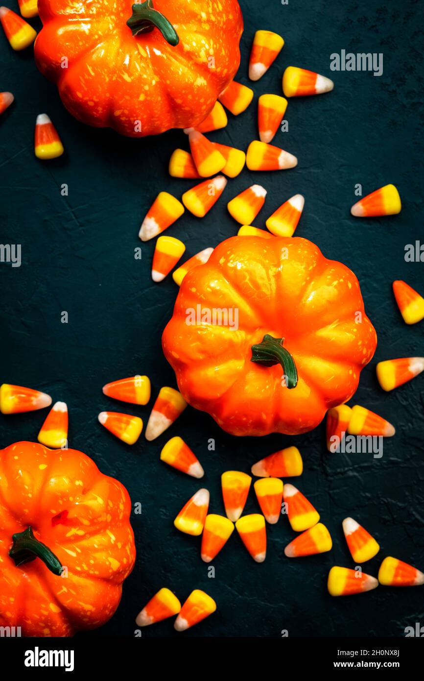 Halloween pumpkin and candy corn banner on blue baclground. Top view ...