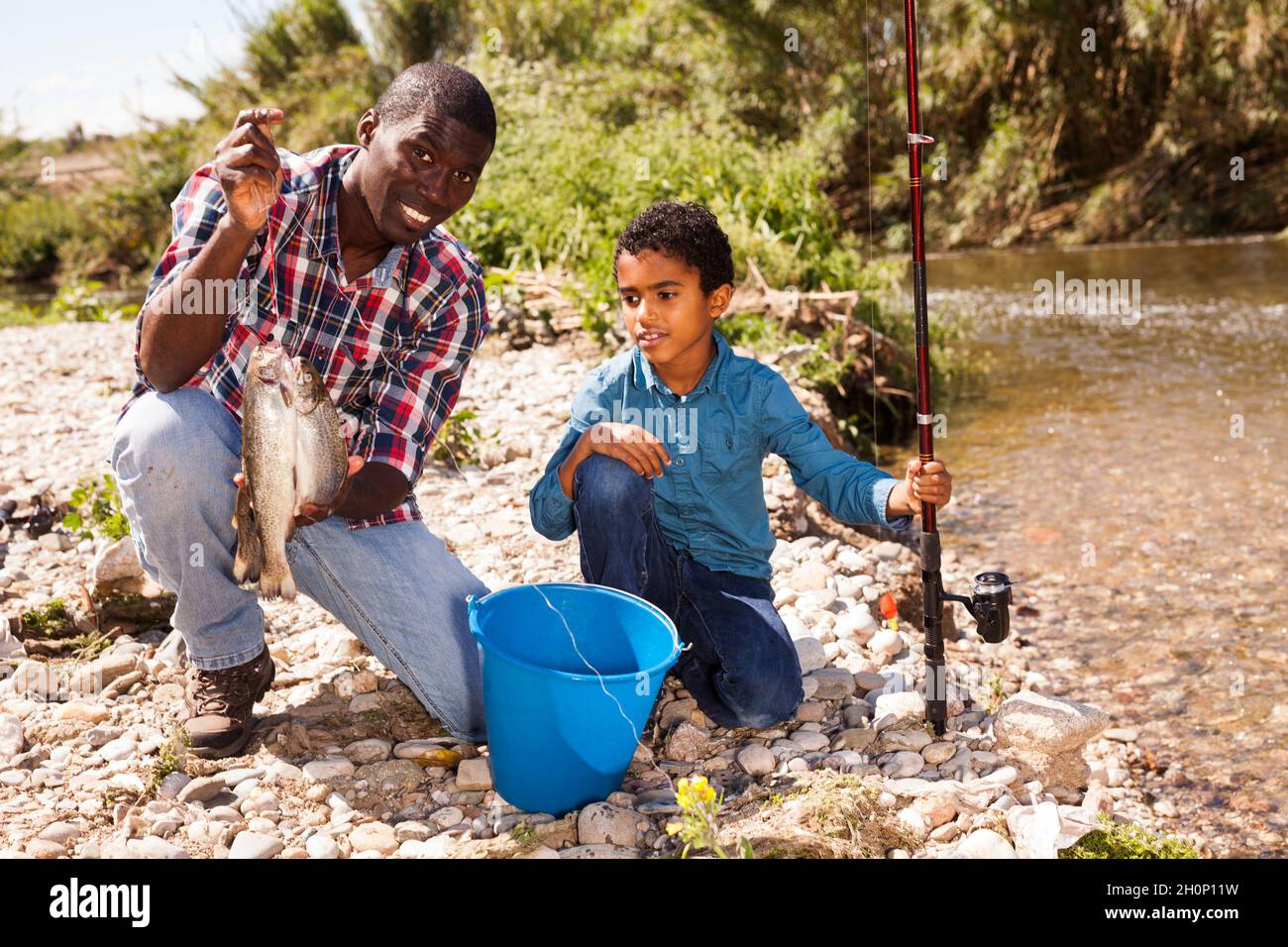 Fishing bucket boy hi-res stock photography and images - Alamy