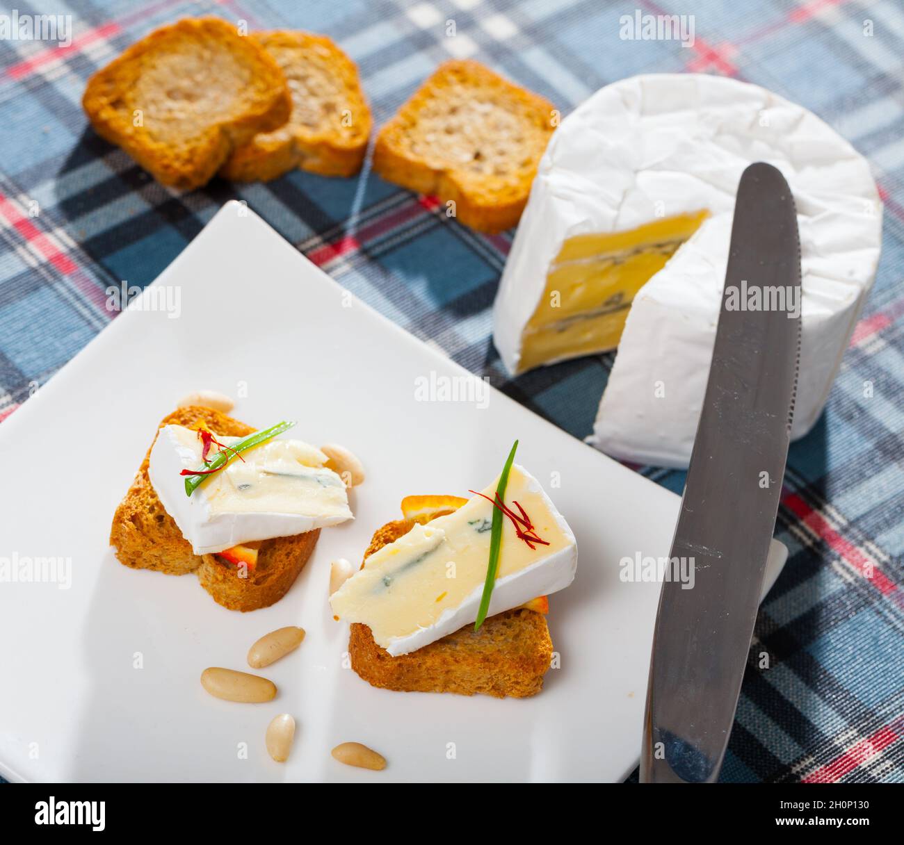 Canape with orange and blue cheese Stock Photo - Alamy