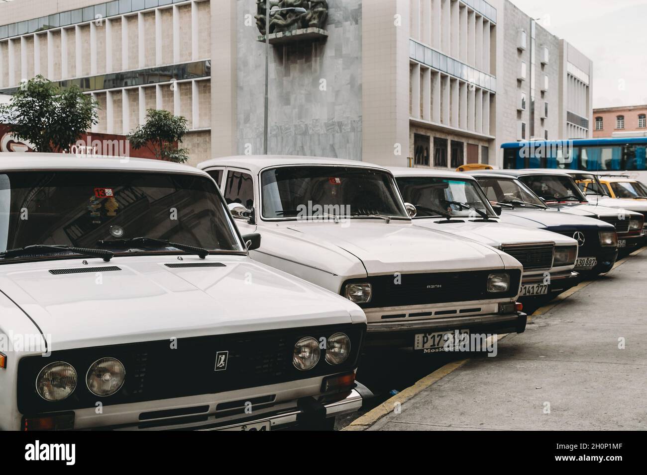 Old Russian cars parked in front of an office building in La Habana ...