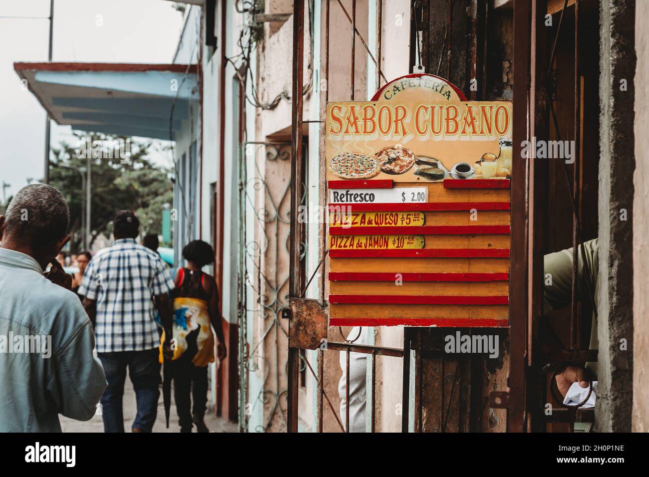 Menu at the entrance of a Cuban paladar restaurant, street view ...