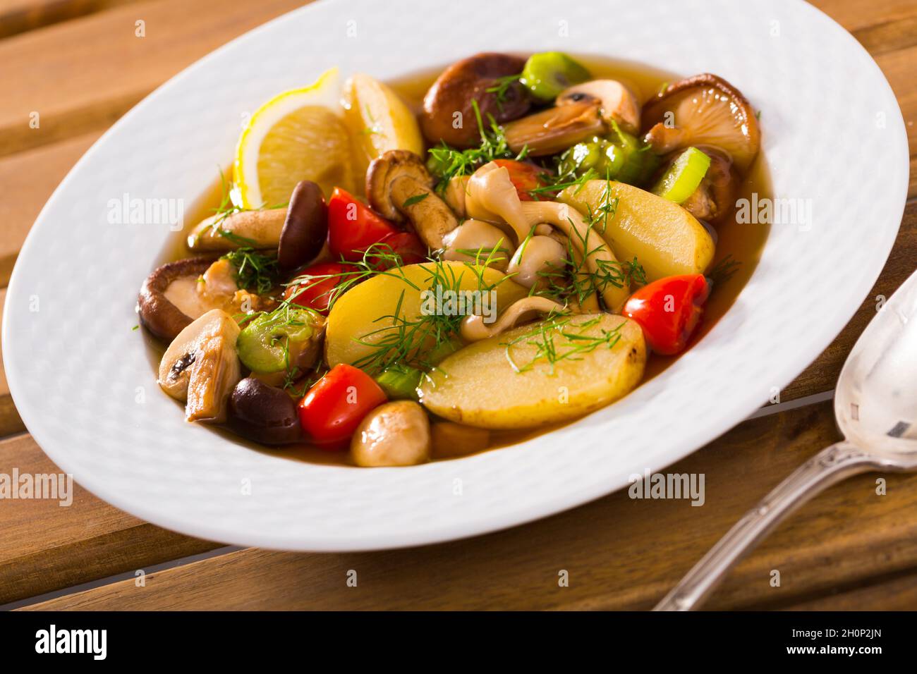 Mushroom hoosh boiled with honey fungus and vegetables Stock Photo - Alamy
