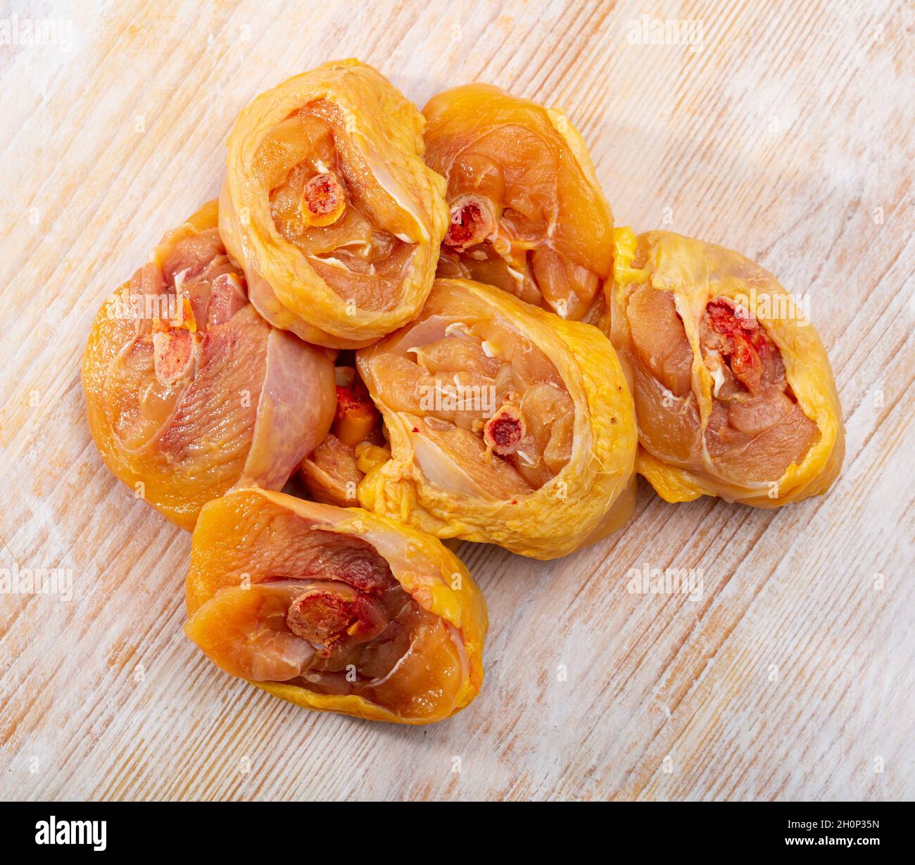 Raw sliced transversely chicken legs Stock Photo - Alamy