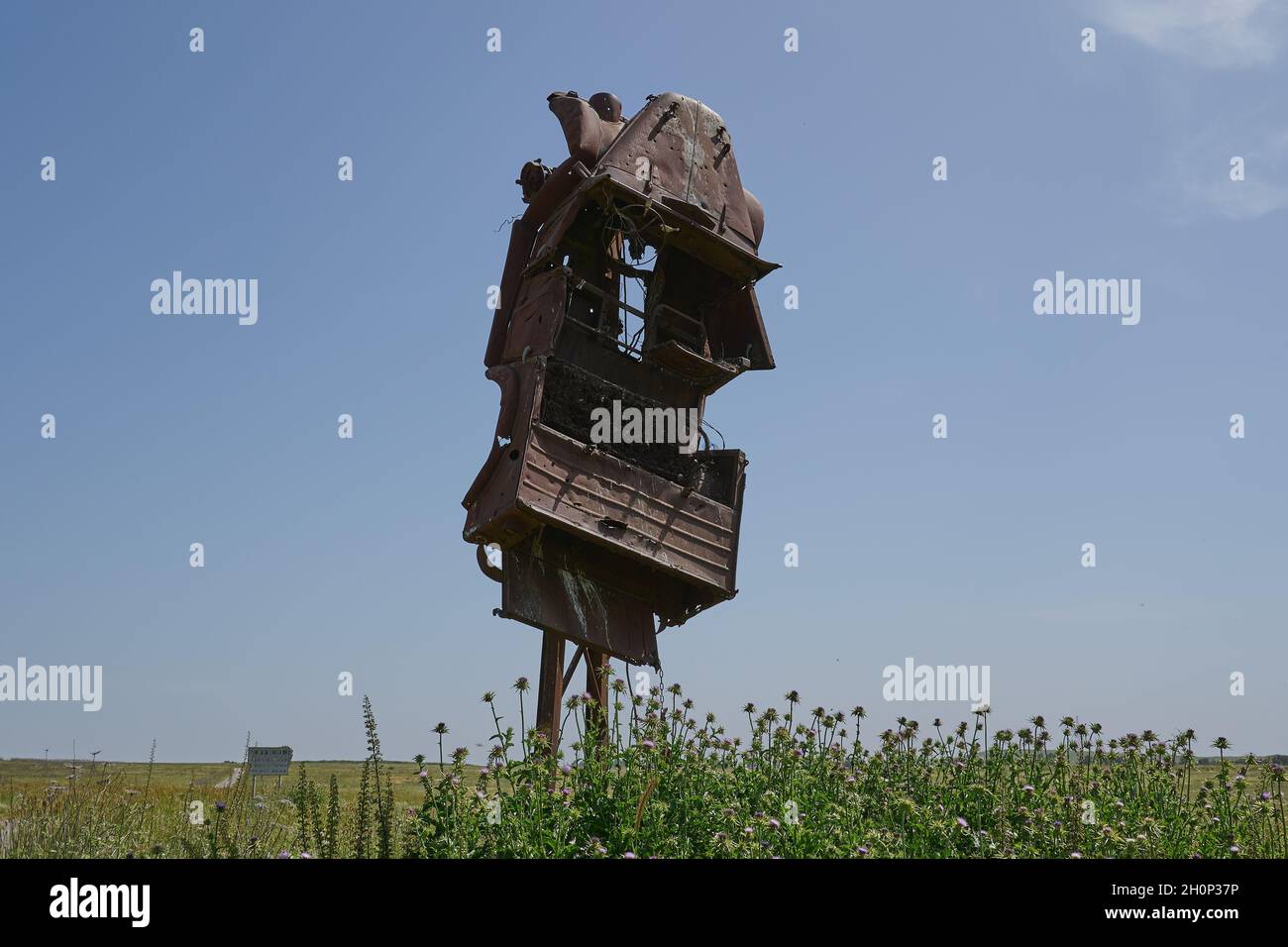 the rusty skeleton of a military vehicle in the Golan Heights after the ...