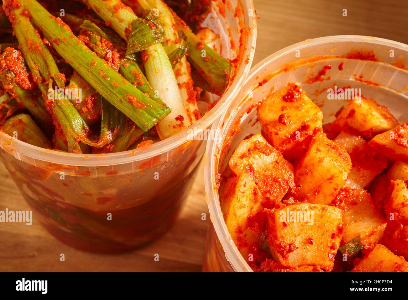 Containers of radish and green onion kimchi, the national dish of Korea ...