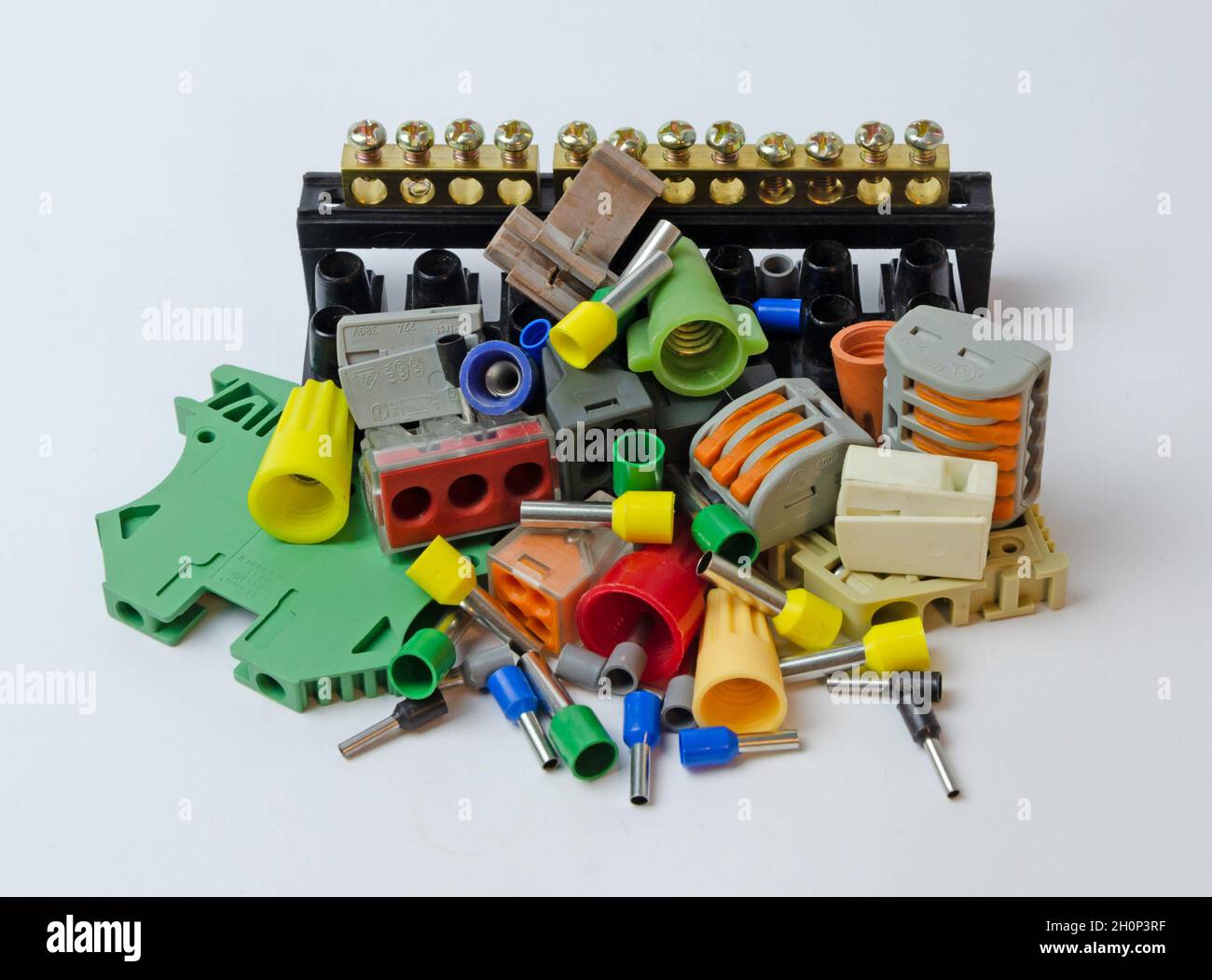 different connectors for electrical wires lie on a white background ...
