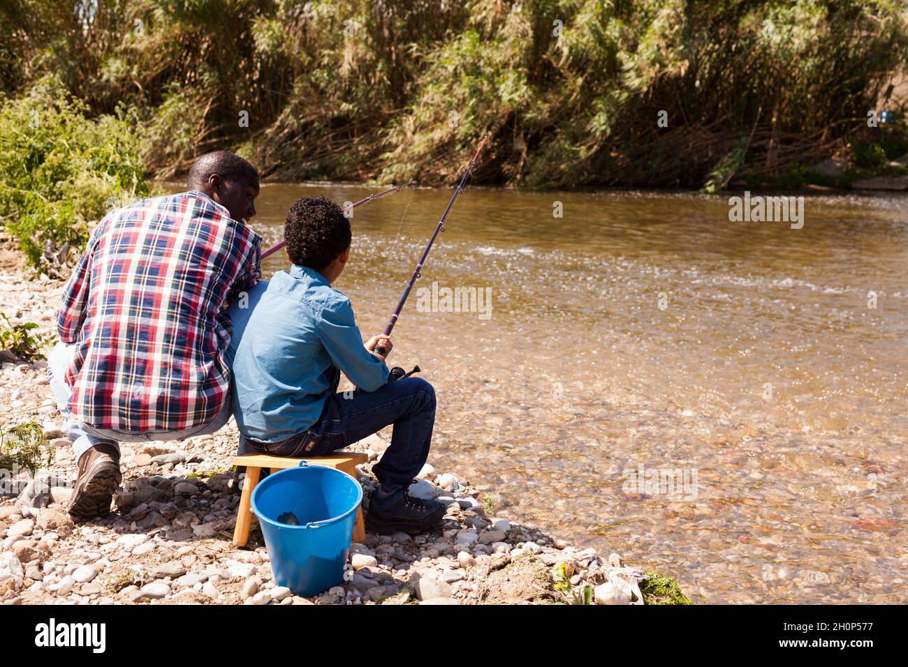 Back portrait of fishermen Stock Photo - Alamy