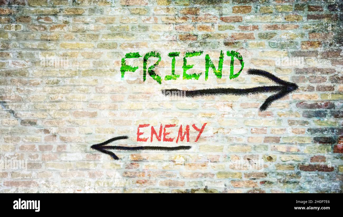 Street Sign the Direction Way to Friend versus Enemy Stock Photo - Alamy