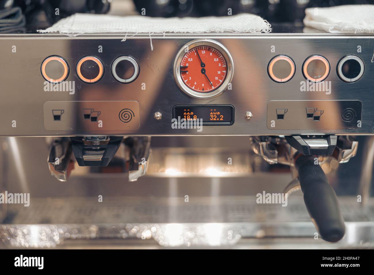Cleaning clothes on professional coffee machine in cafe Stock Photo - Alamy