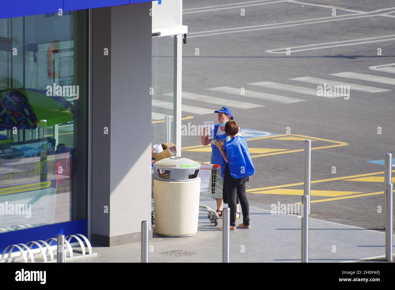 Product demonstrators in front of a shopping center Stock Photo - Alamy