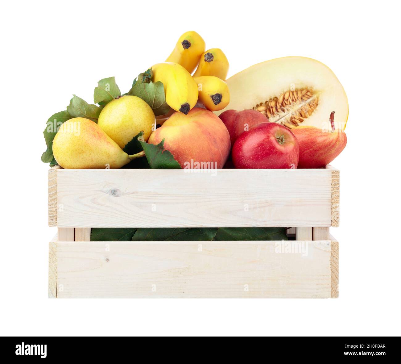 Fresh fruits in a wooden box isolated on a white background. Apples ...