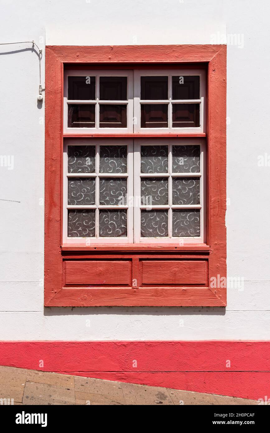 Traditional red painted window in canarian colonial style house in the ...