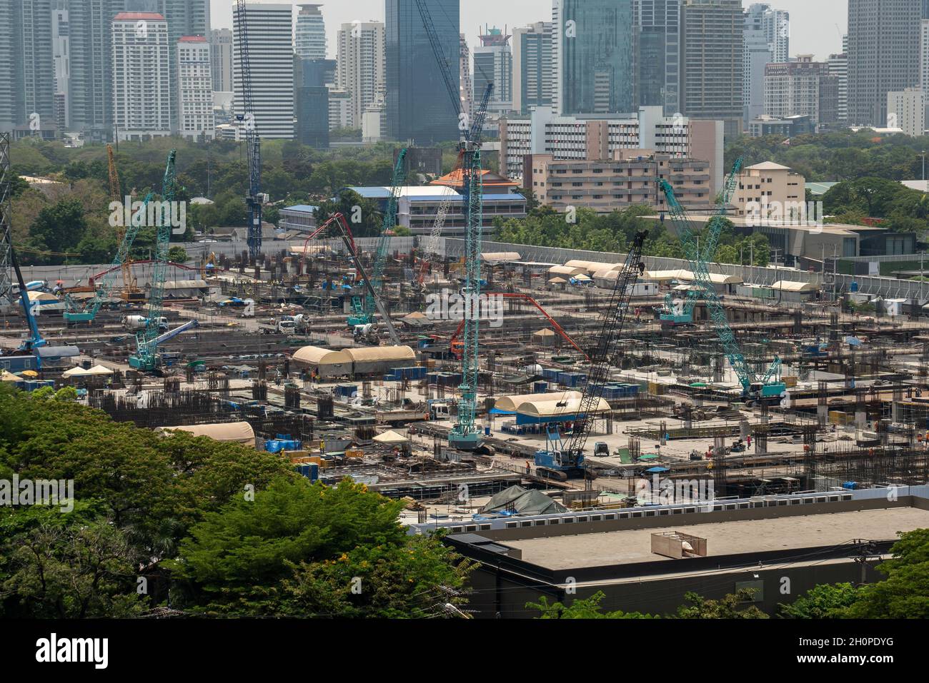 Large construction site with heavy construction machinery in metropolis ...