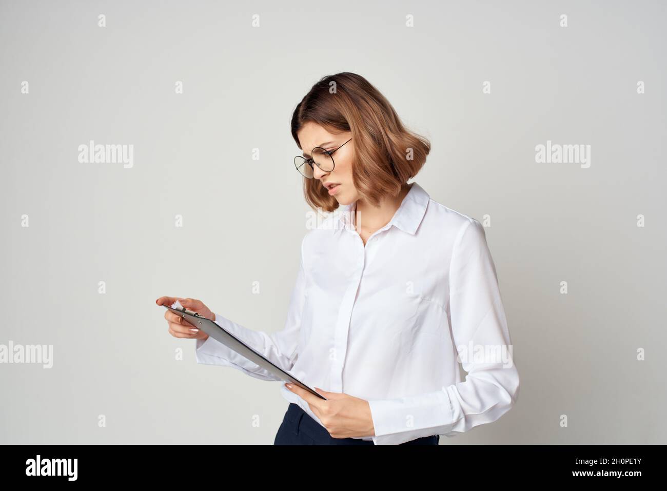 manager posing office work light background emotions Stock Photo - Alamy