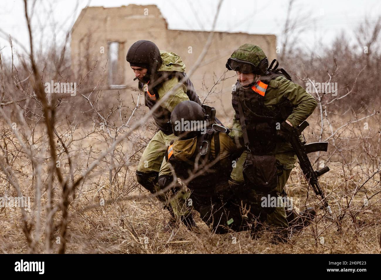 OMON (riot police) servicemen carry out a wounded comrade from the ...