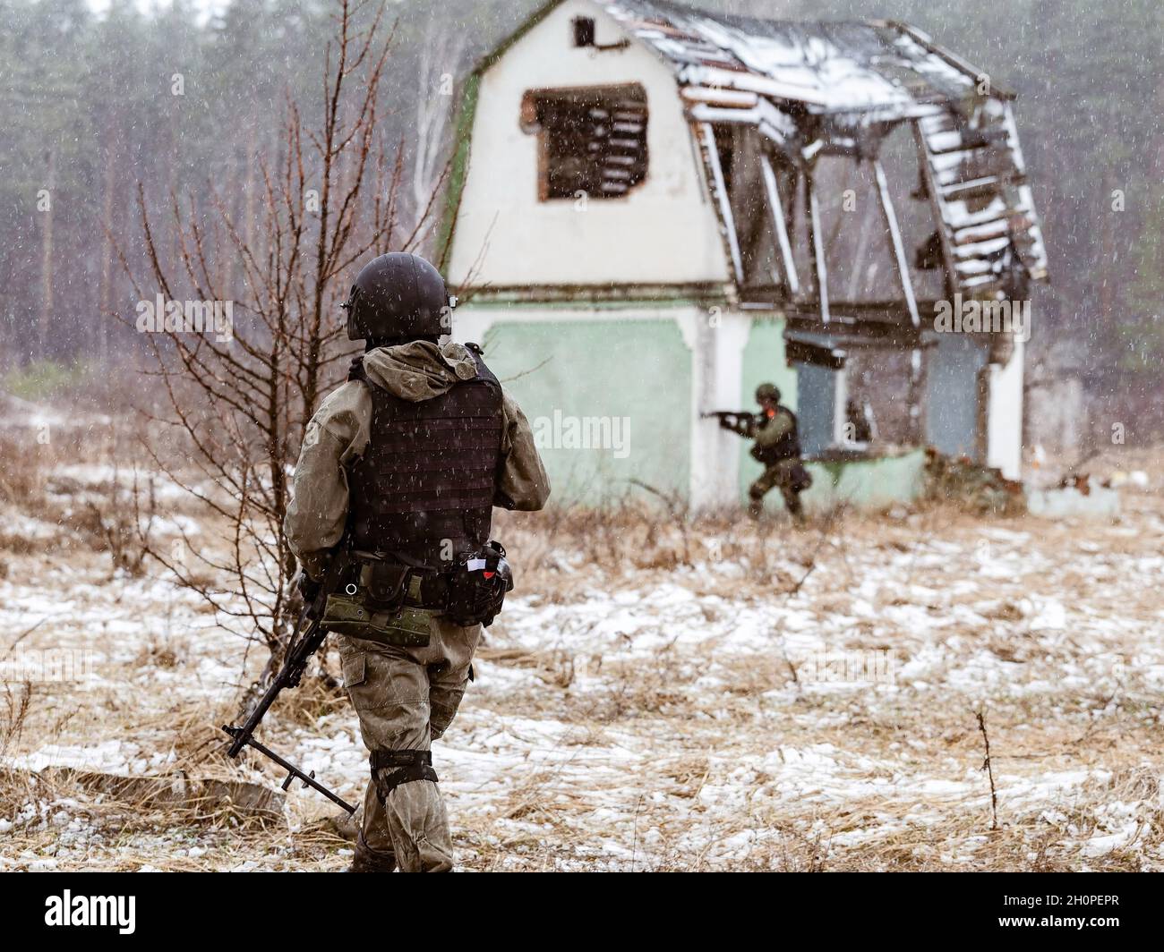 OMON (riot police) servicemen inspect unfamiliar fortifications during ...