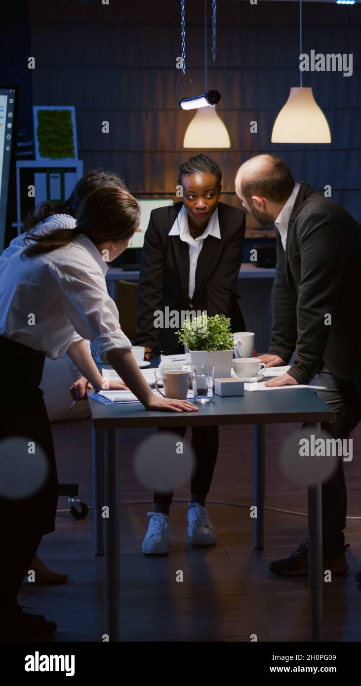 Diverse multi ethnic businesspeople teamwork lean on conference table ...
