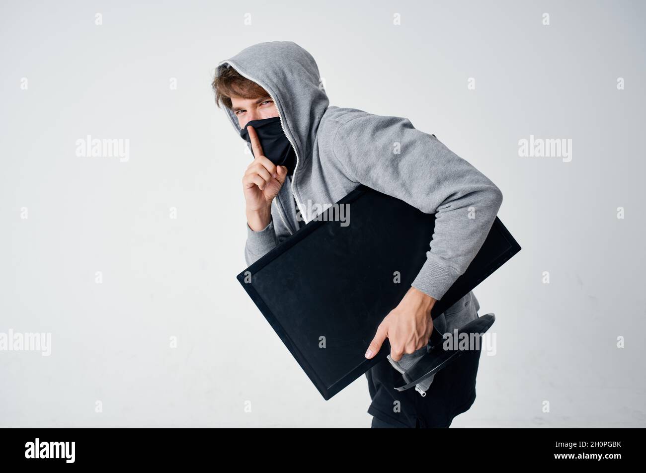 male thief hooded head hacking technology security isolated background ...