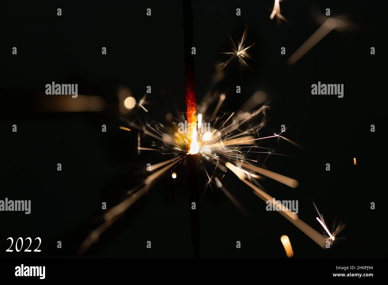 Burning Bengal fire on a black background New Year's symbol, close up ...