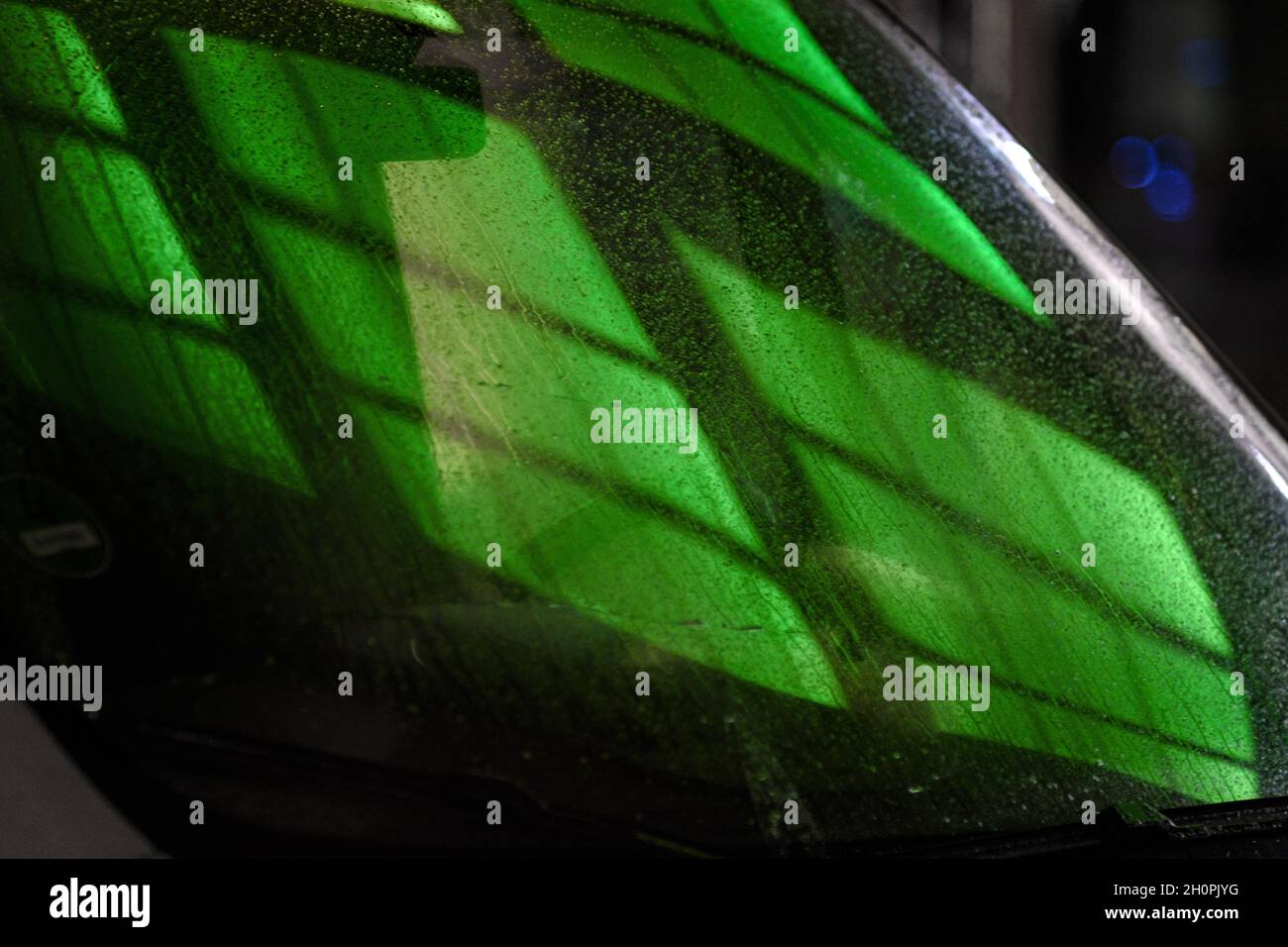 Shot of the car windshield reflecting the residential building window ...