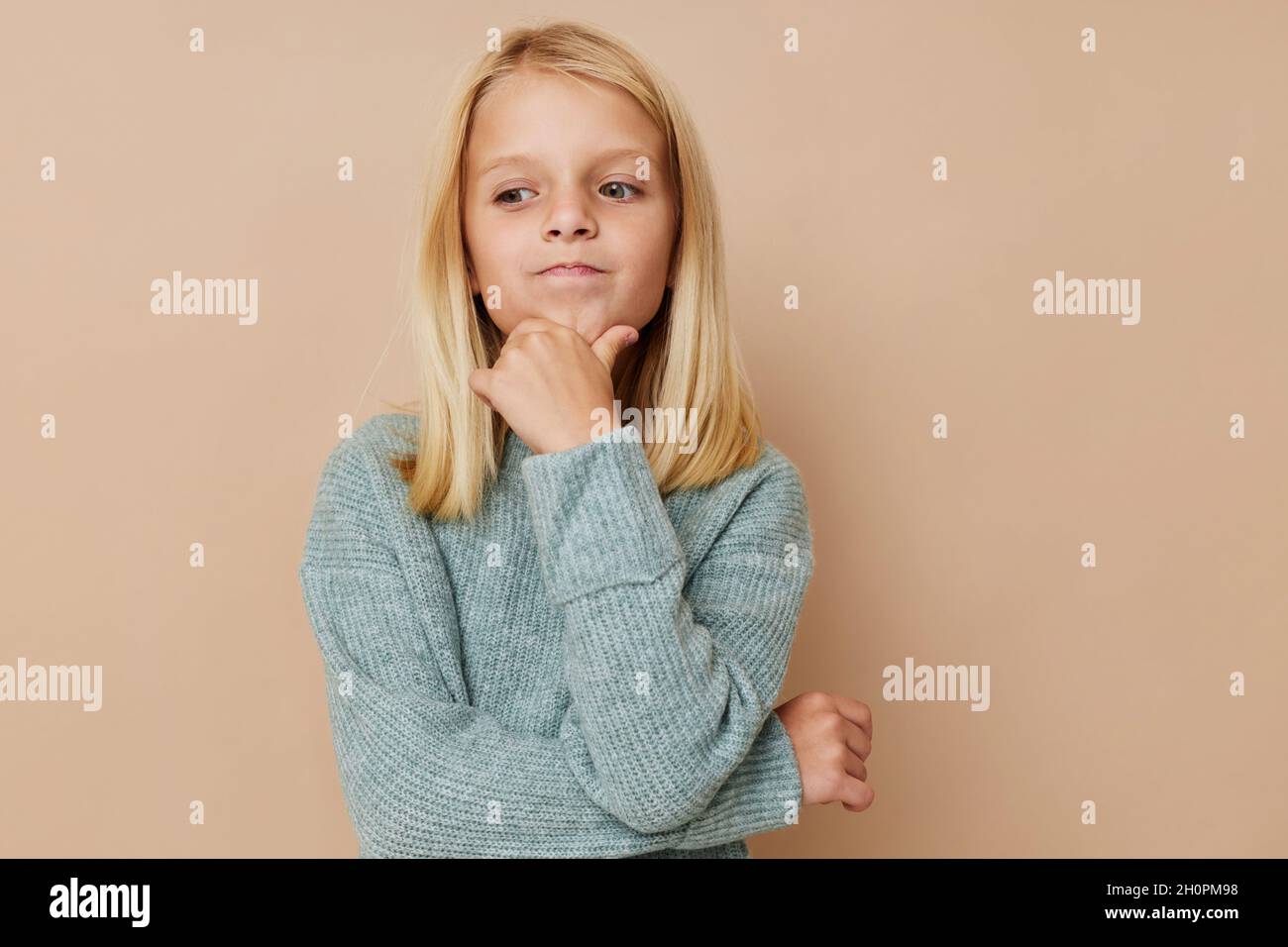Positive little girl gestures with his hands kids lifestyle concept ...