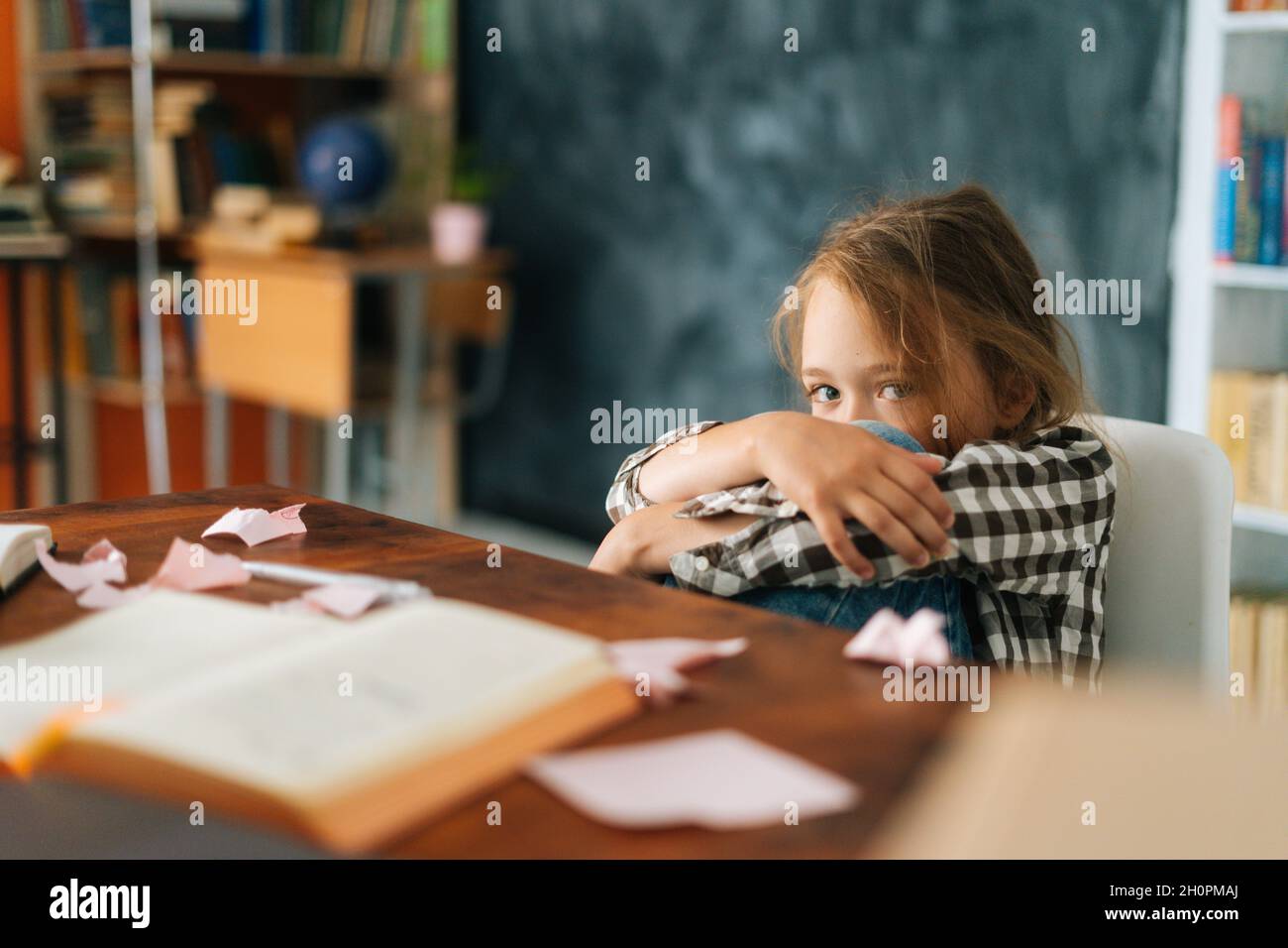 Girl Sitting Alone In School