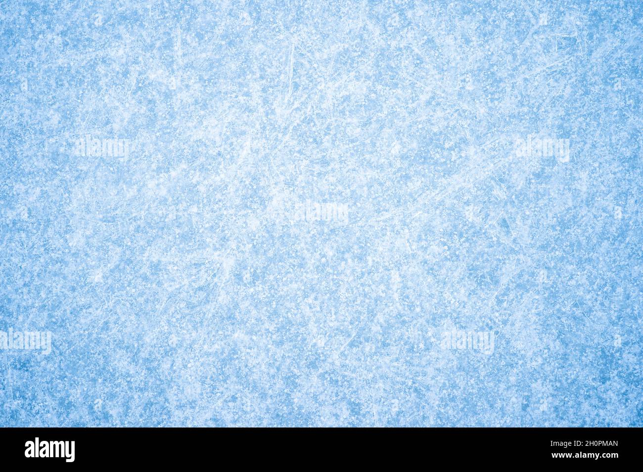 Blue ice in an openwork pattern of ice and white frost. Natural ...