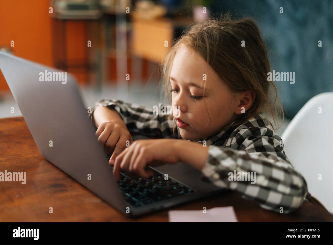 Child typing laptop in classroom hi-res stock photography and images ...
