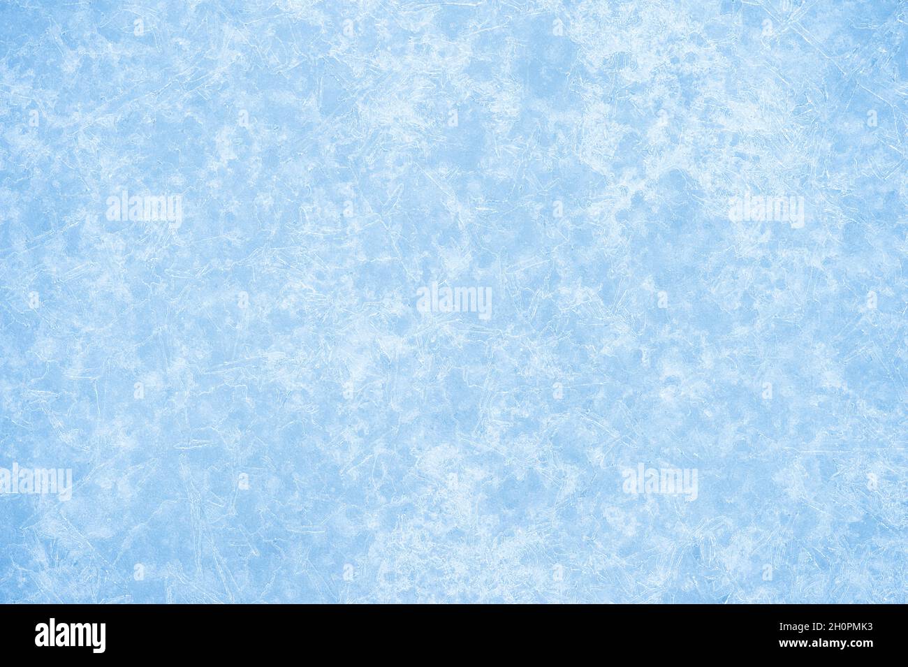 Bluish-gray ice in an openwork pattern of brightly glowing veins in the ...