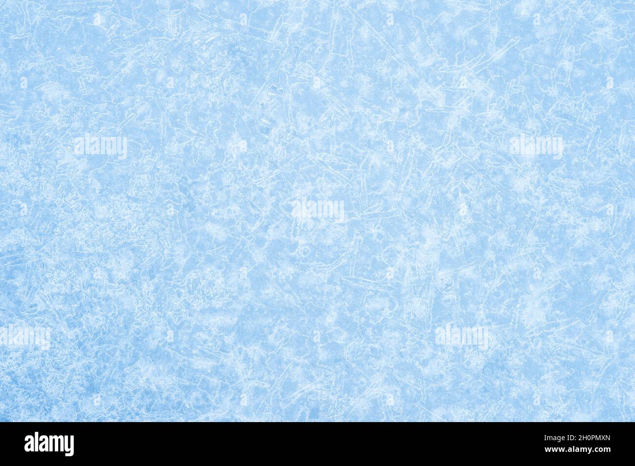 Light blue ice in an openwork pattern of glowing ice veins. Background ...