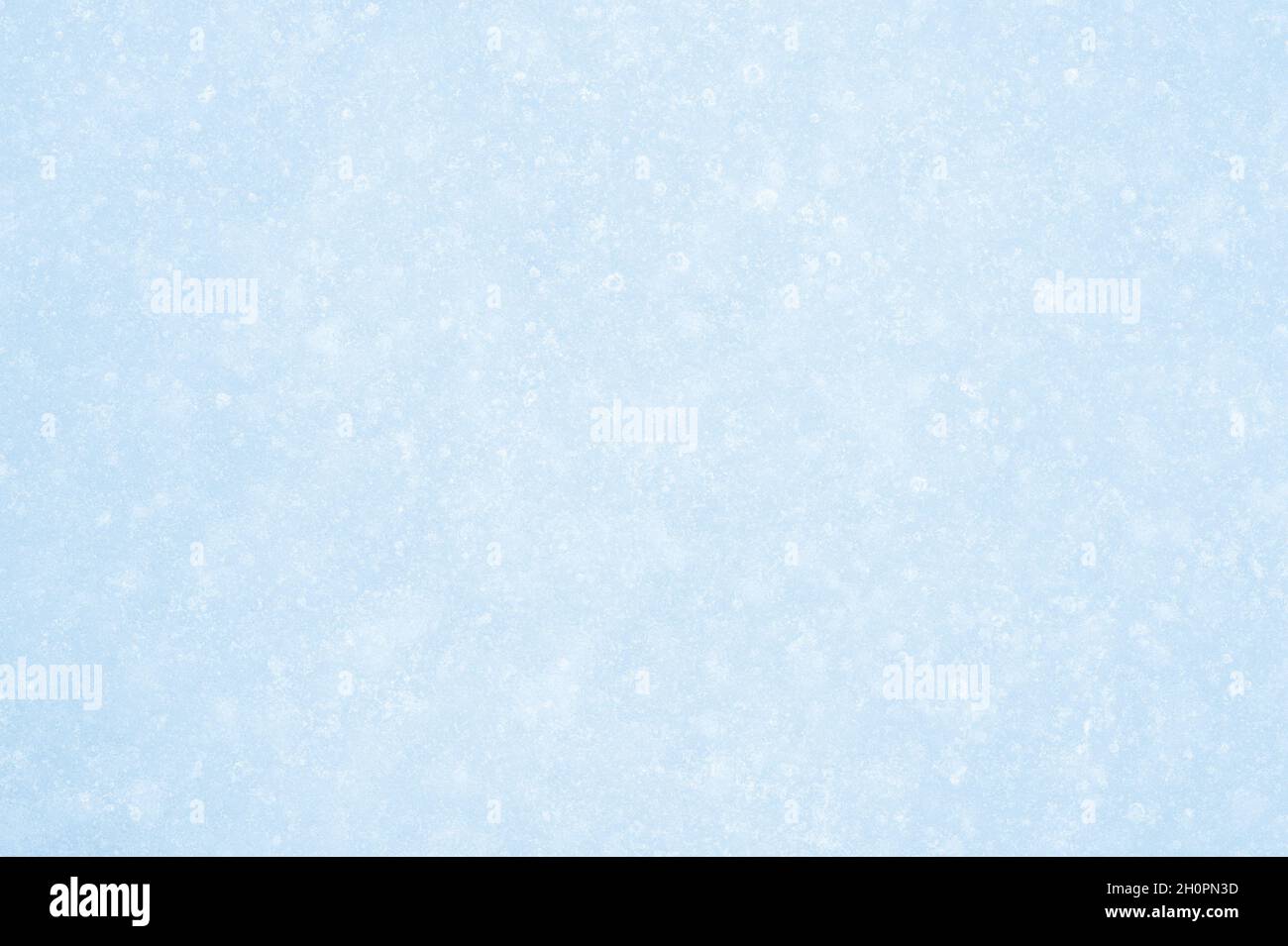 Pale blue ice is textured with a luminous curly pattern of ice veins in ...