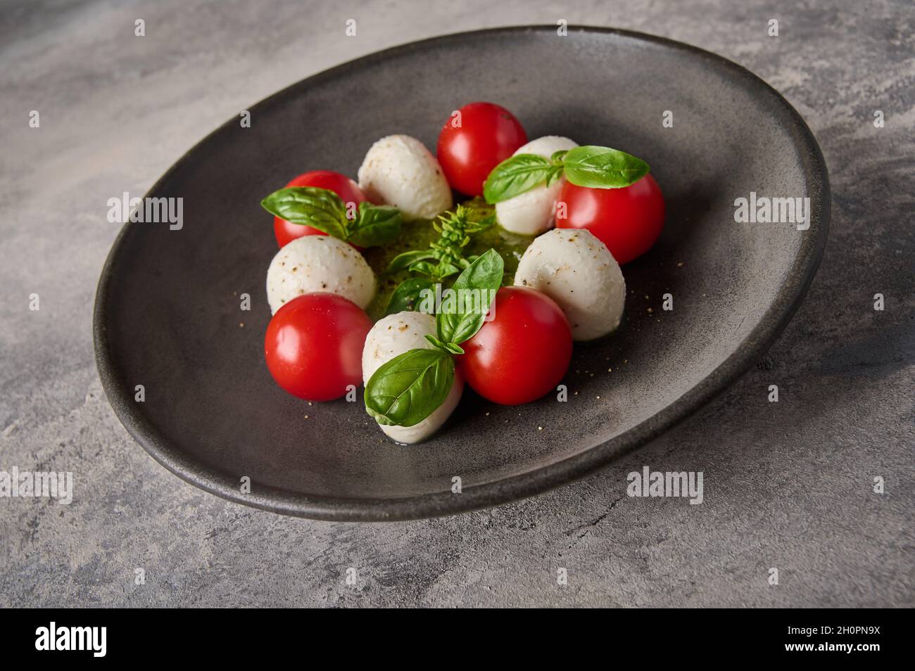 Italian caprese salad with ripe tomatoes, fresh basil and mozzarella ...