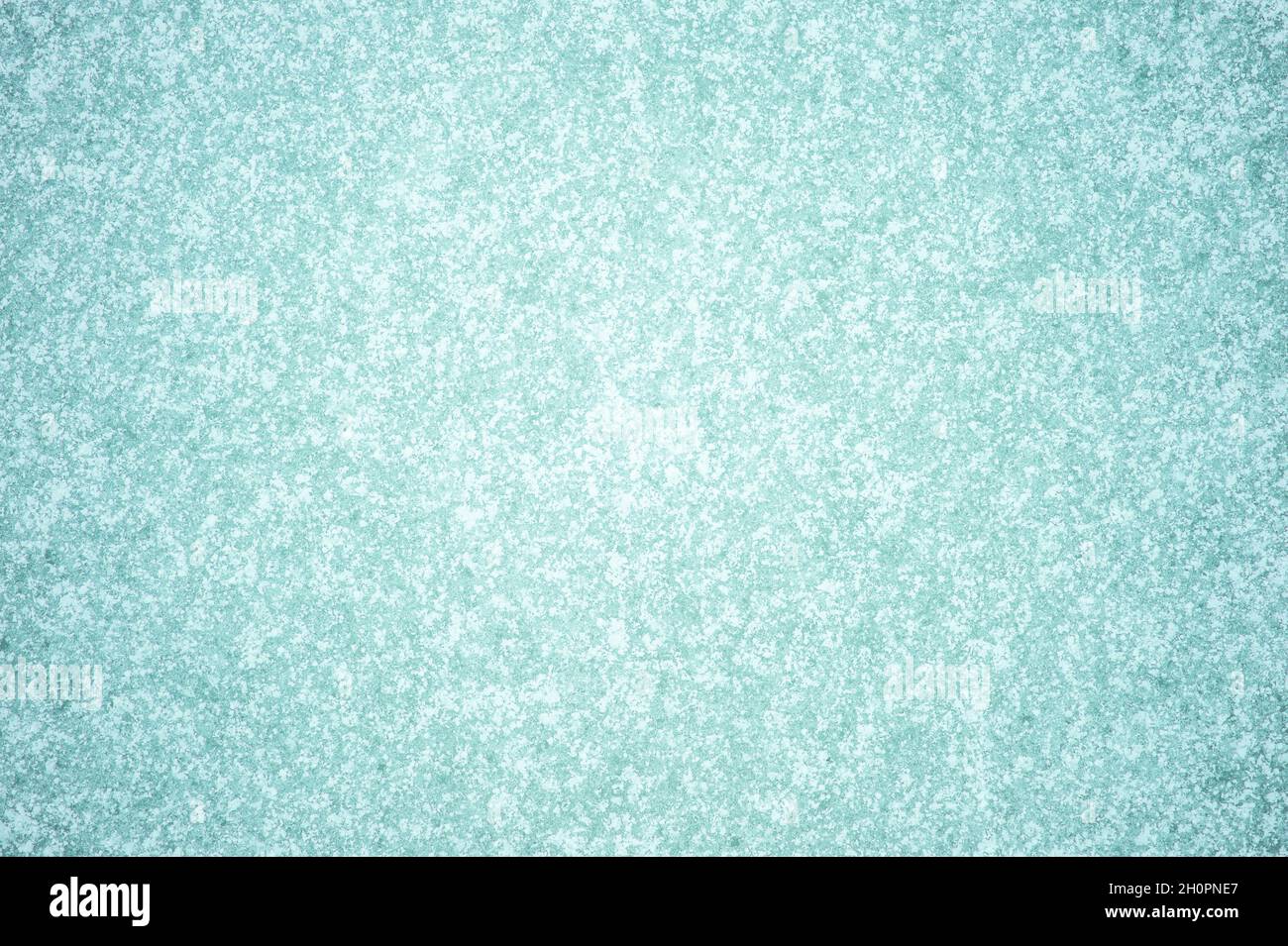 White frost pattern with illumination on a muted background with a ...