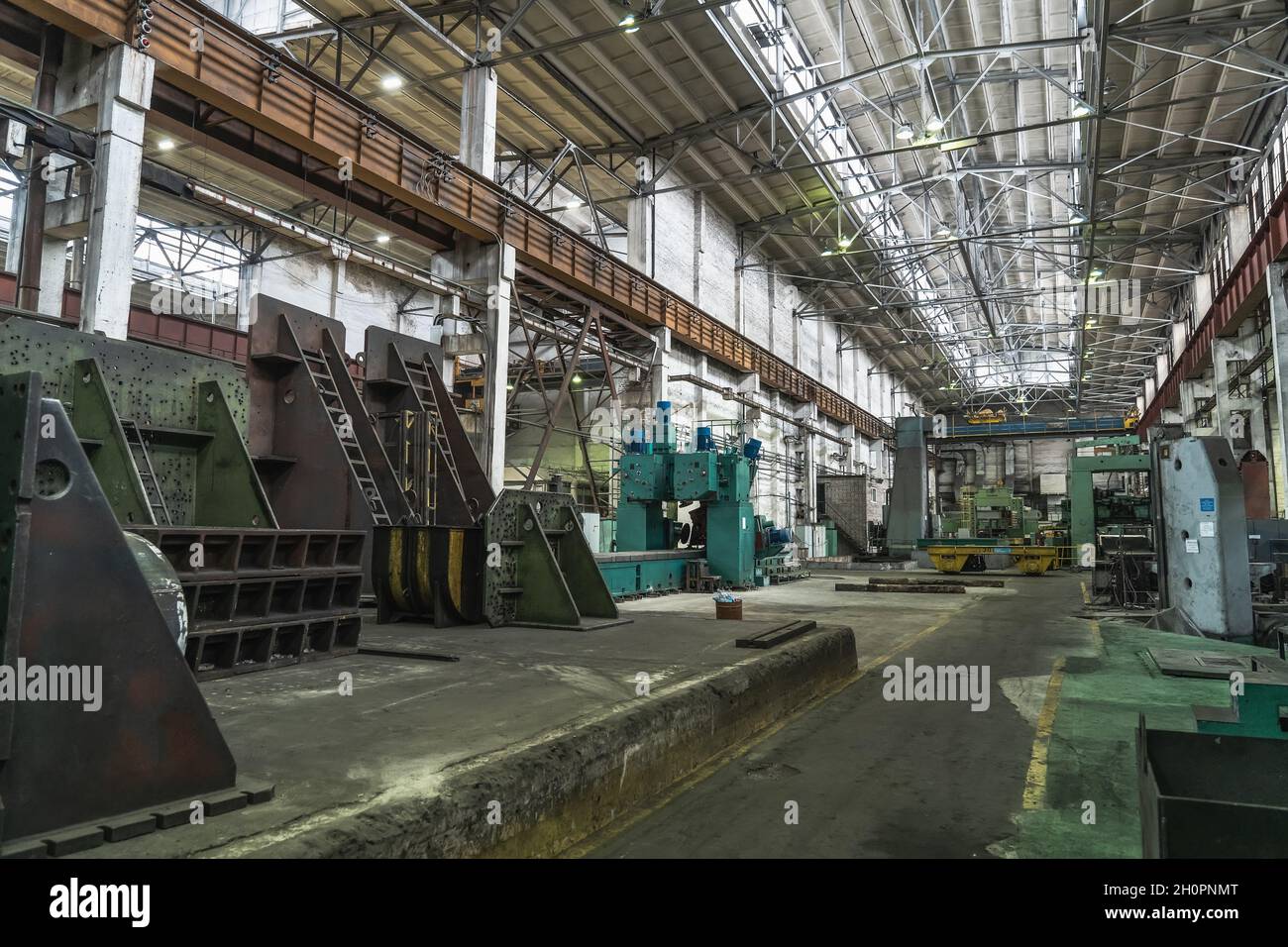 Industrial interior of metalworking factory. Workshop with many machine ...