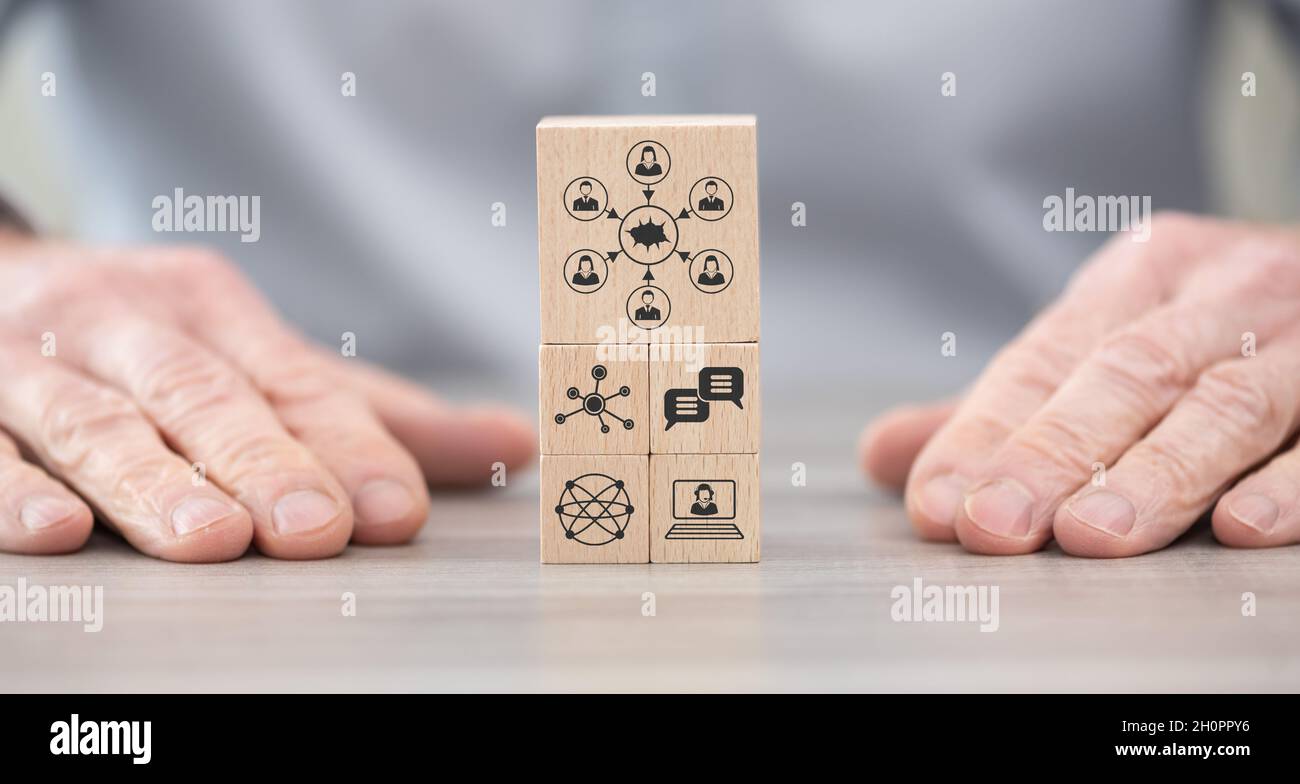 Wooden blocks with symbol of meeting concept Stock Photo - Alamy