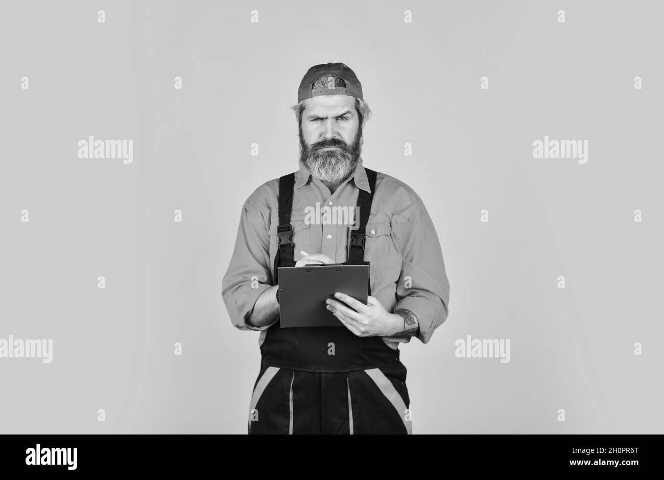 concentrated on work. construction worker holding folder. Structural ...