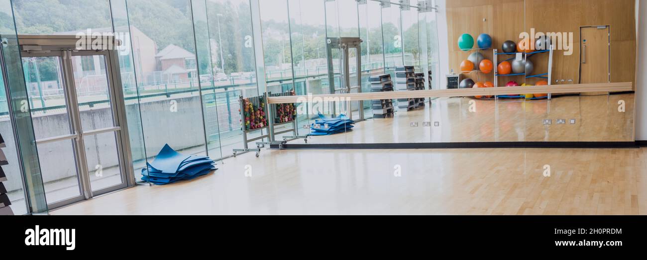 View of interior of a modern gym with sports equipment Stock Photo - Alamy