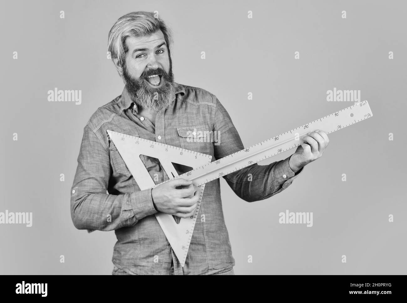 Free education. Teaching geometry. Long or short. Bearded man use ruler ...