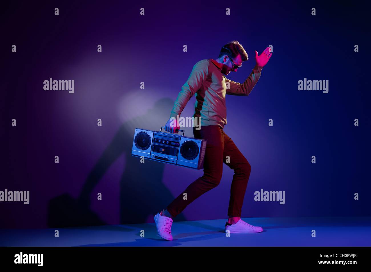 Full body profile photo of young funky guy dance with boom box wear ...