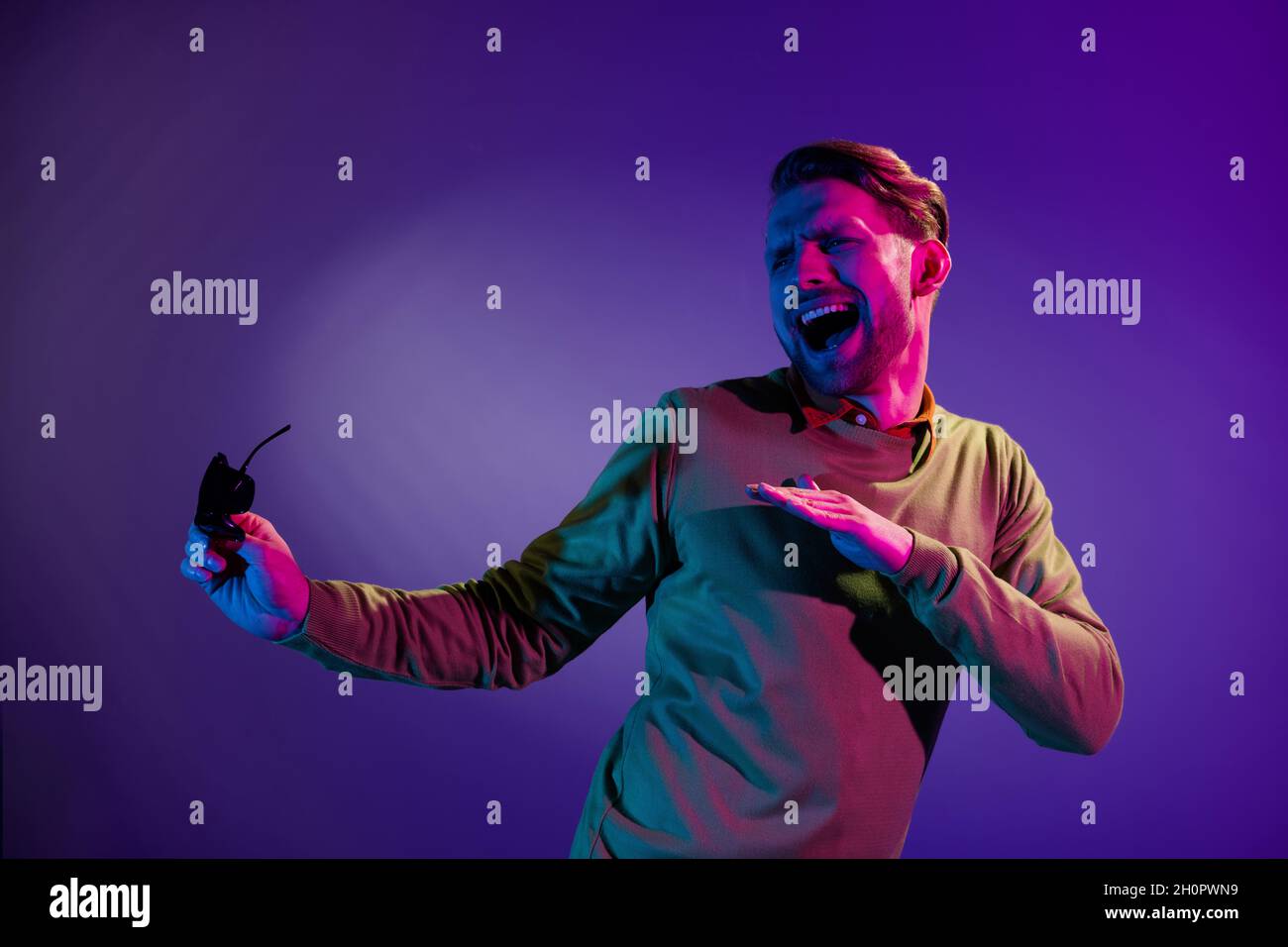 Photo of young excited man happy positive smile have fun enjoy music ...