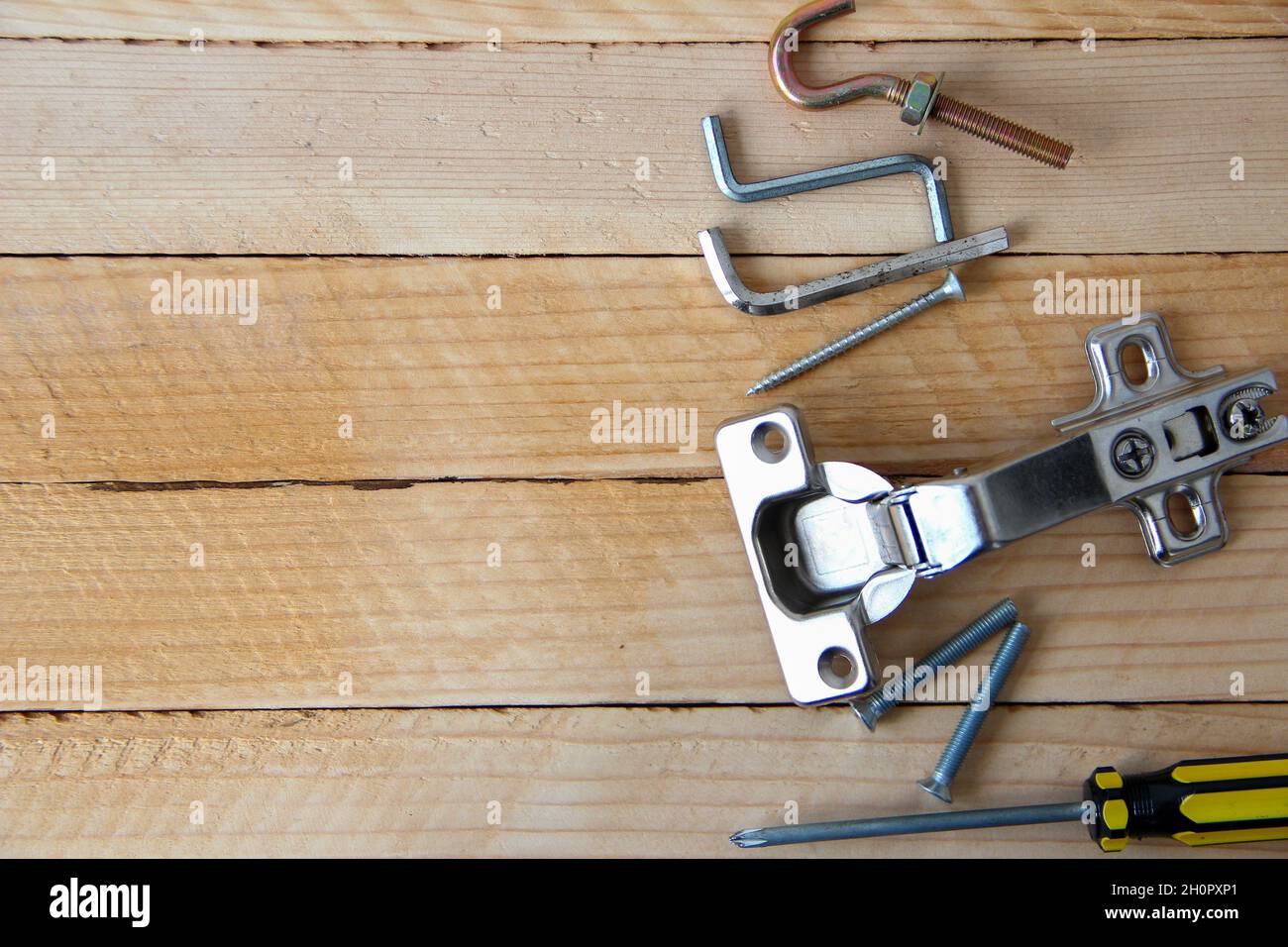 Set of tools and accessories for assembling furniture on a wooden ...