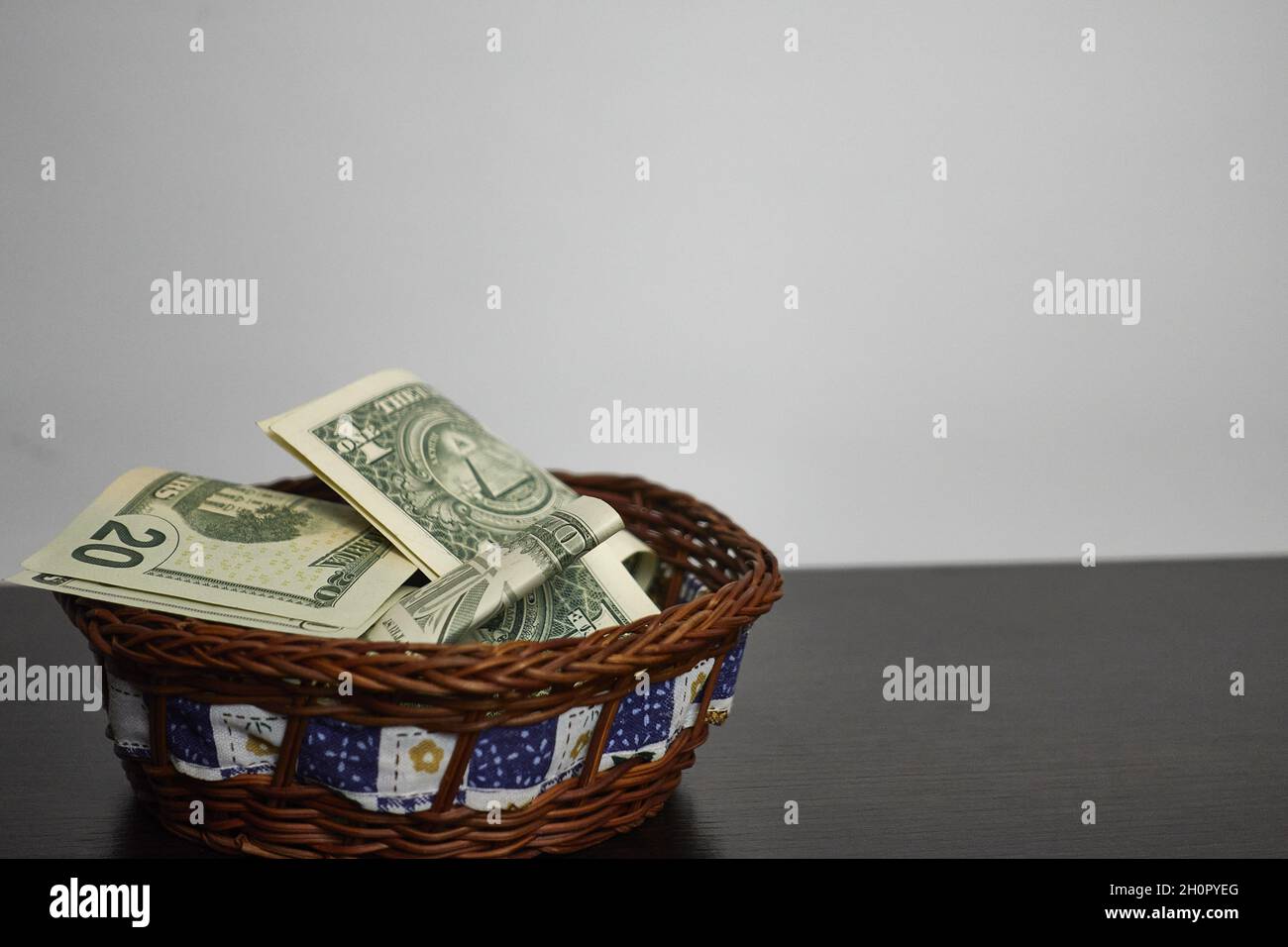 Money offering basket hi-res stock photography and images - Alamy