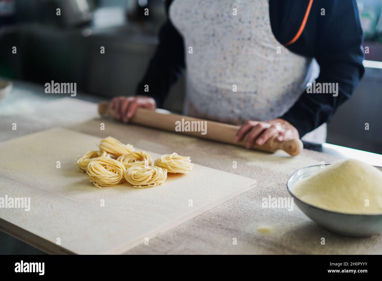 Woman prepare traditional pasta inside italian factory Stock Photo - Alamy