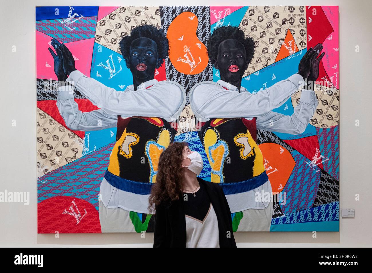 London, UK. 14 October 2021. A staff member views "Things fall apart ...