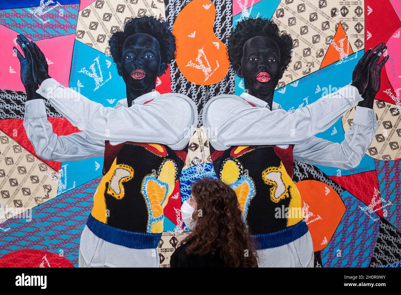 London, UK. 14 October 2021. A staff member views "Things fall apart ...