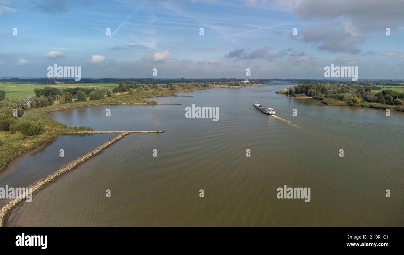 Inland container barge on River Lek aerial view near the village of ...